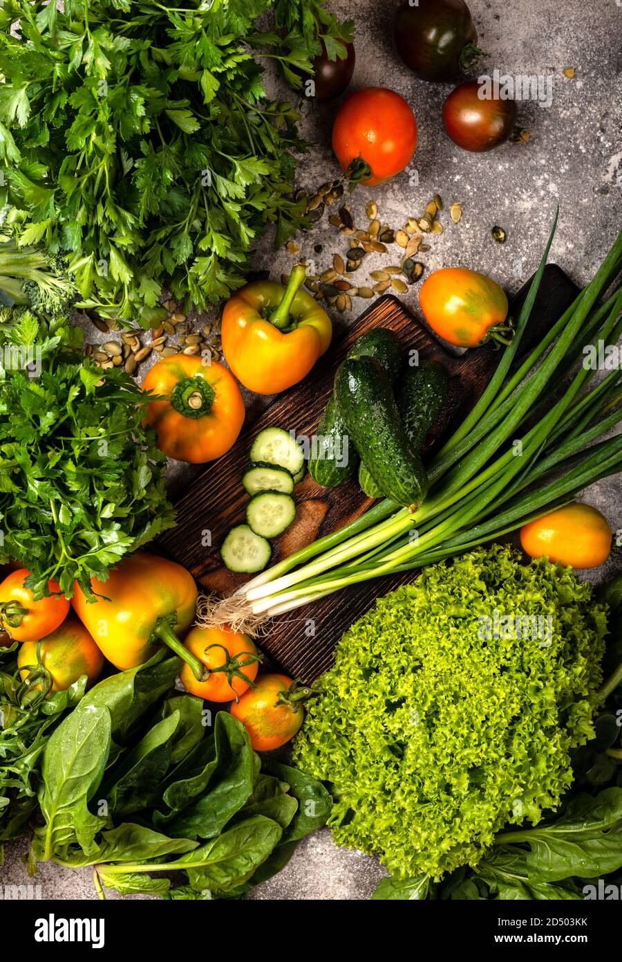 Vegan menu set. Organic vegetables and greens with chopping board on ...