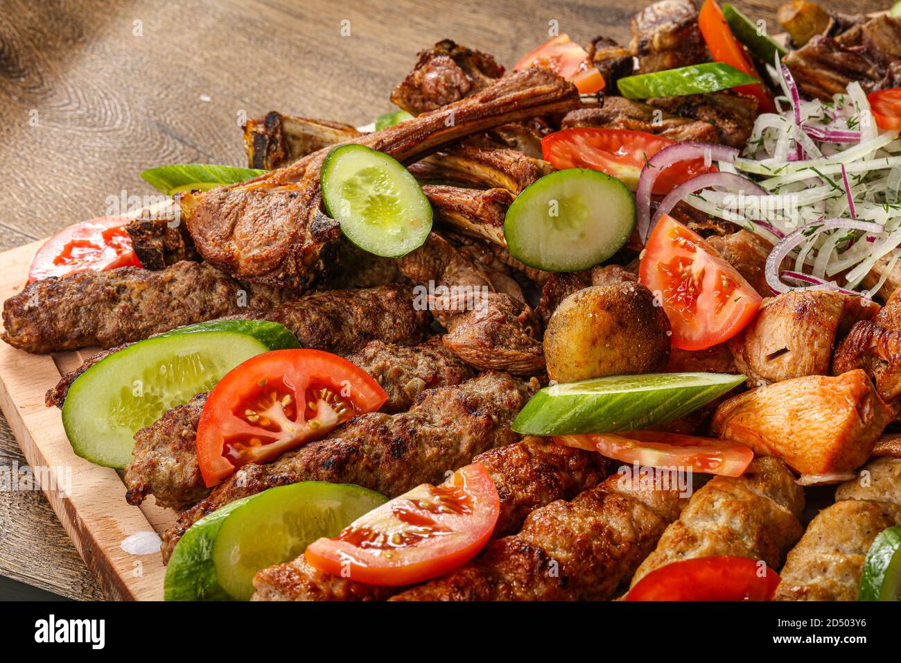 Grilled various meat barbeque mix vith vegetables Stock Photo - Alamy