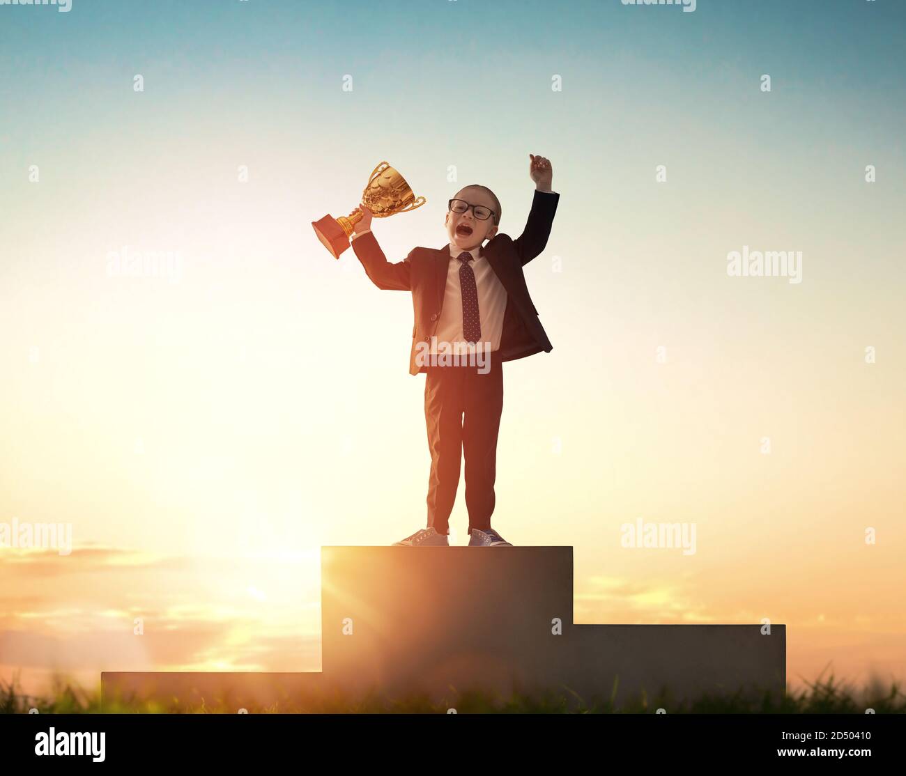 Little child is winner. Kid on sunset background. Smart power concept ...