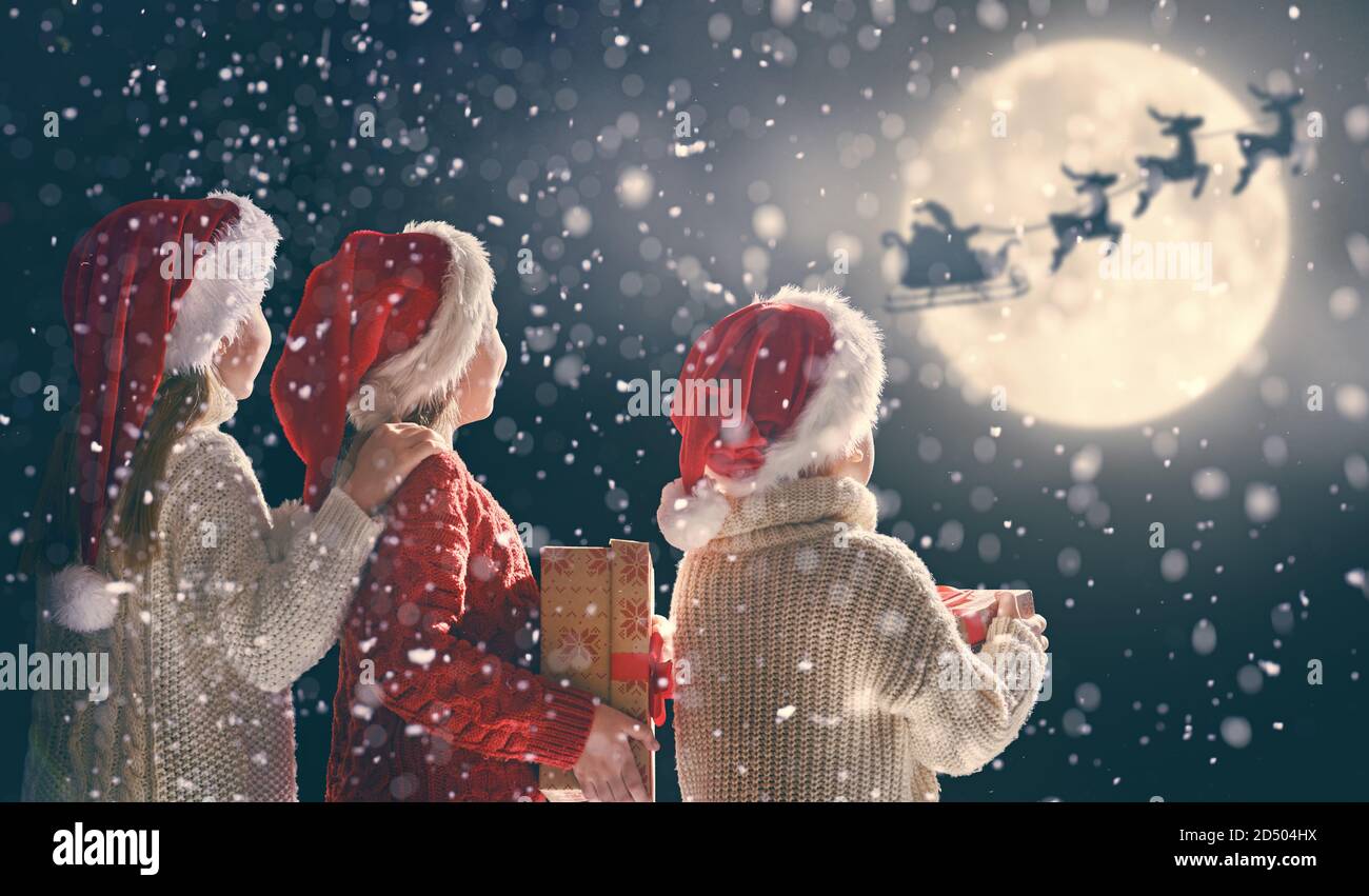 Merry Christmas and happy holidays! Cute little children with xmas ...