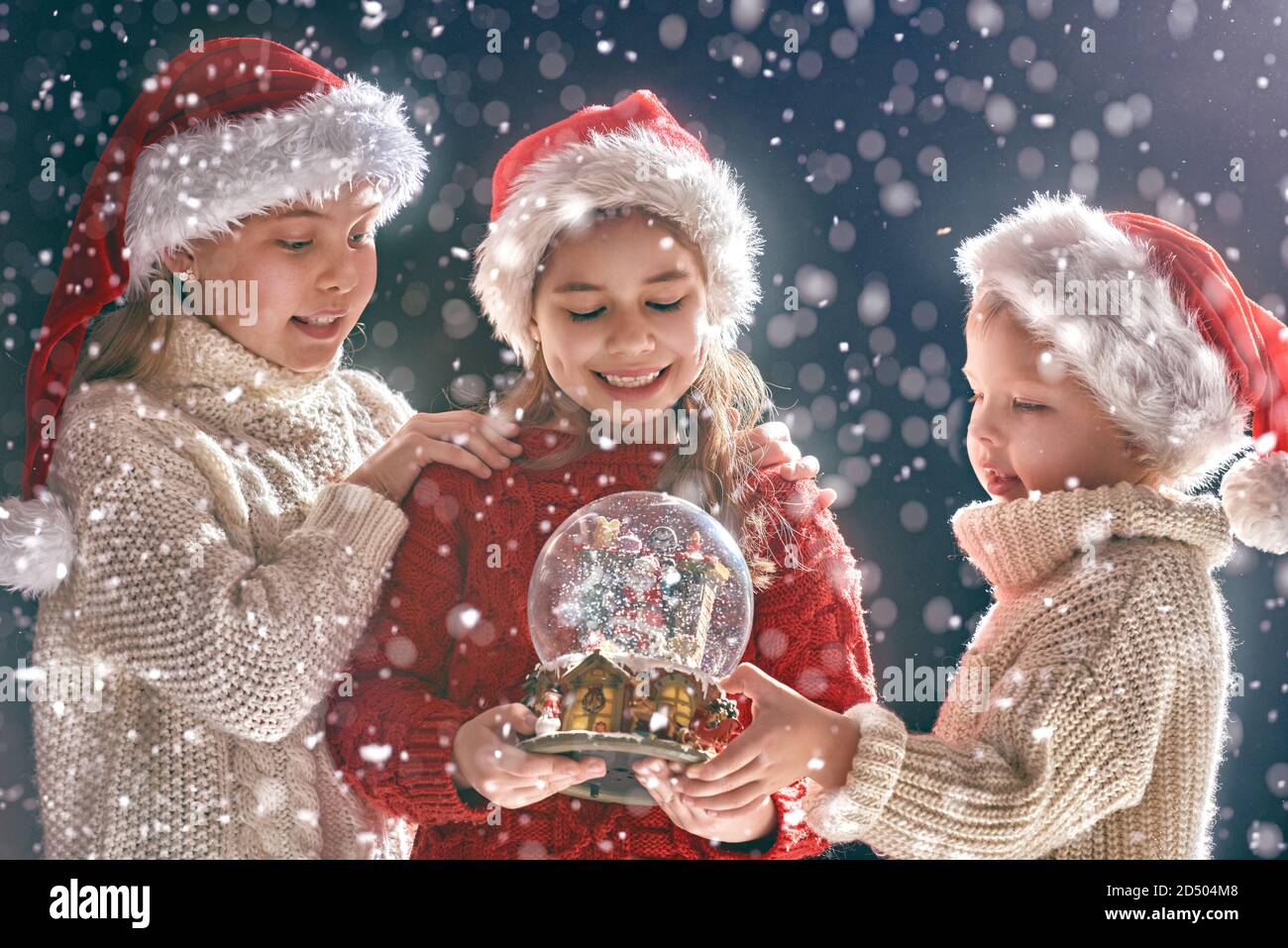 Merry Christmas and happy holidays! Cute little children with snow ...