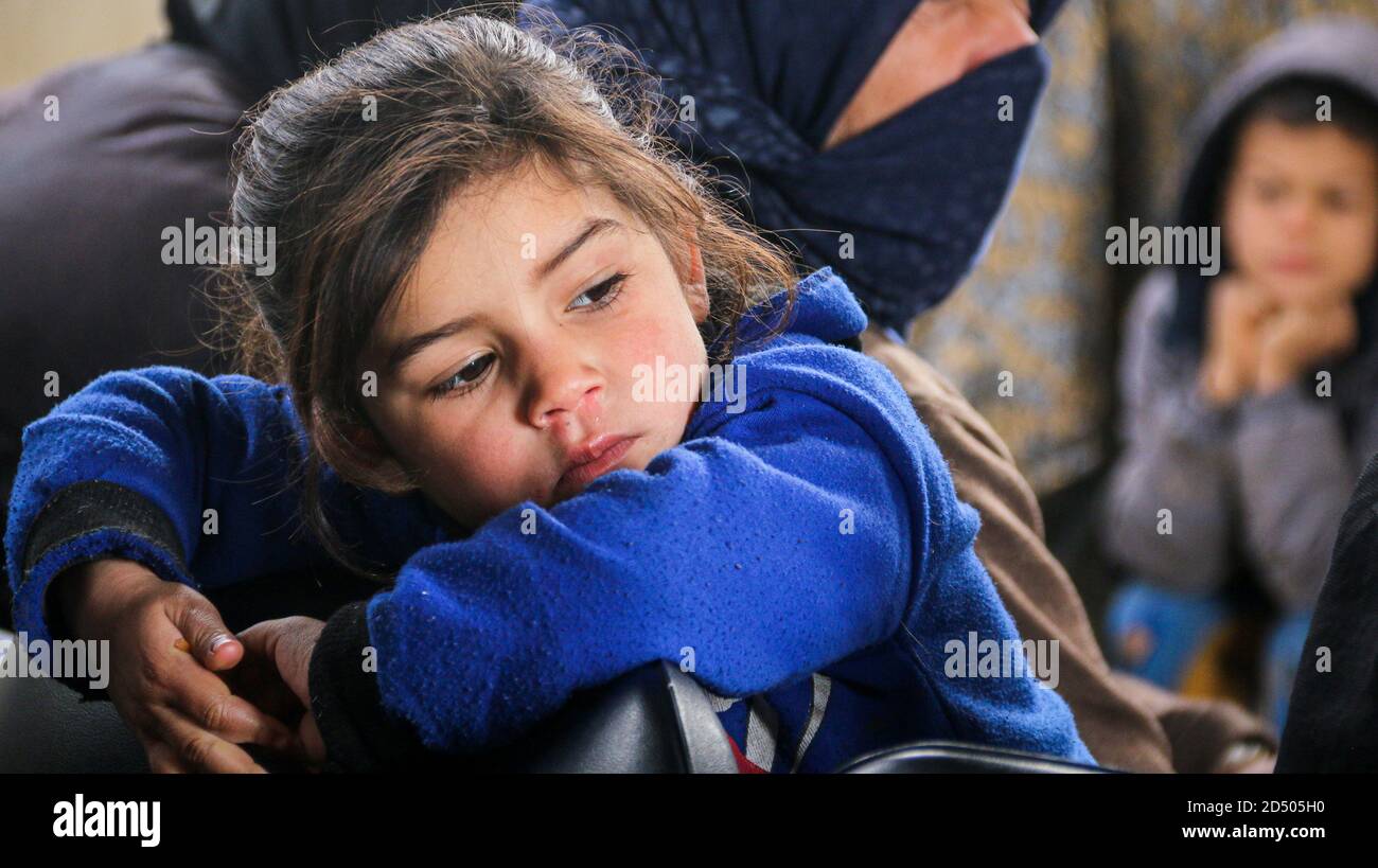 tired child, a sad child's face, sick children waiting to enter the ...