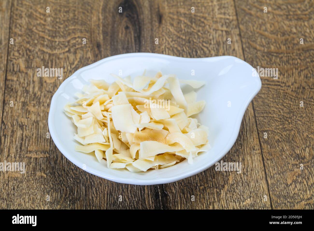 Coconut dry chips snack in the bowl Stock Photo - Alamy