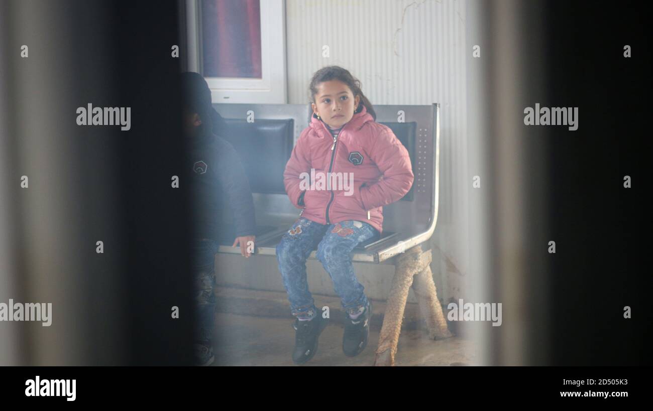 tired child, a sad child's face, sick children waiting to enter the ...