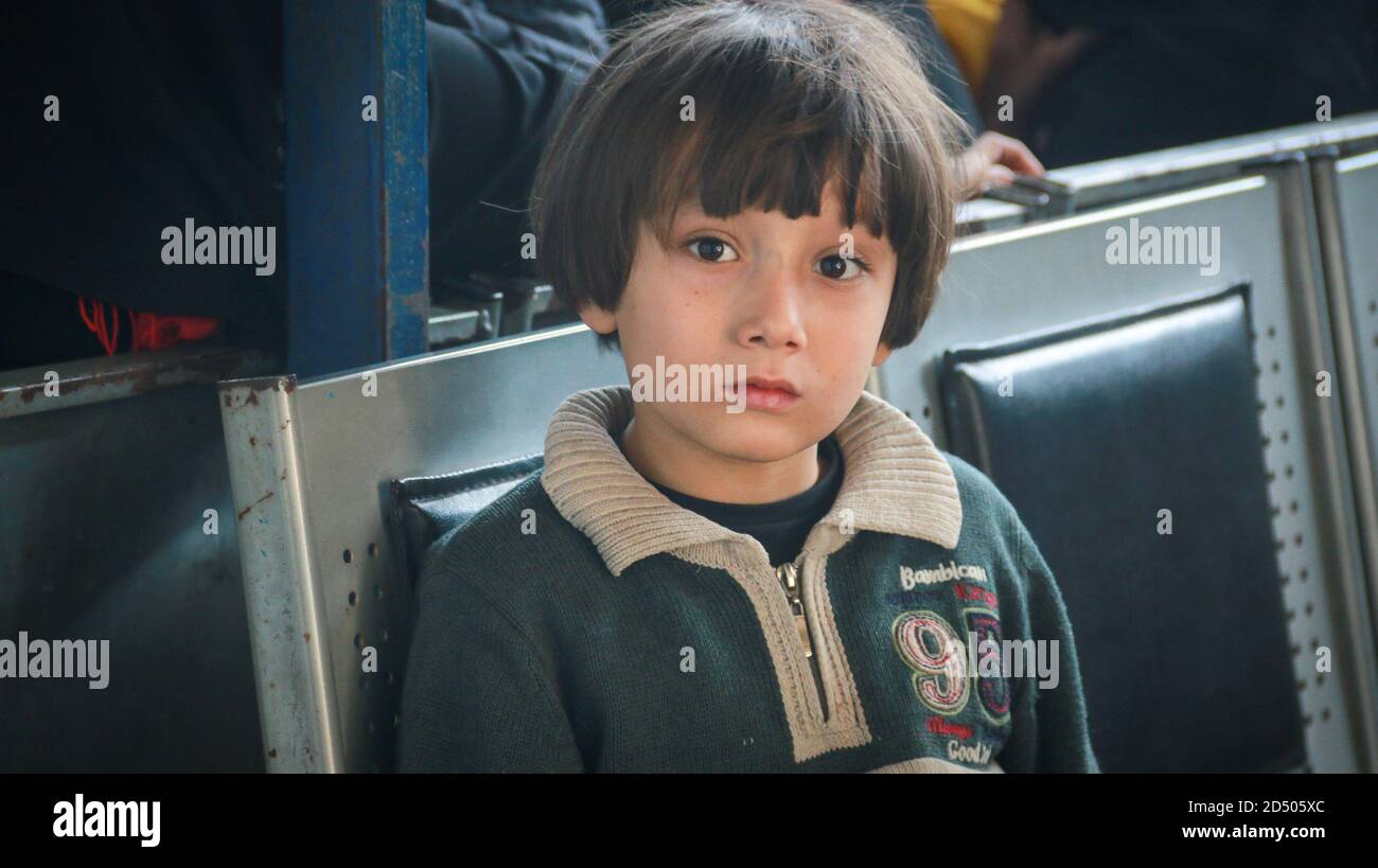 tired child, a sad child's face, sick children waiting to enter the ...