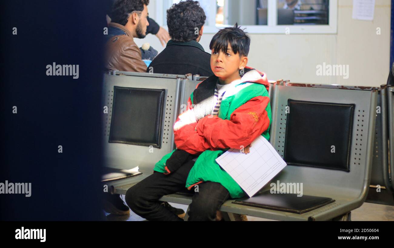 tired child, a sad child's face, sick children waiting to enter the ...