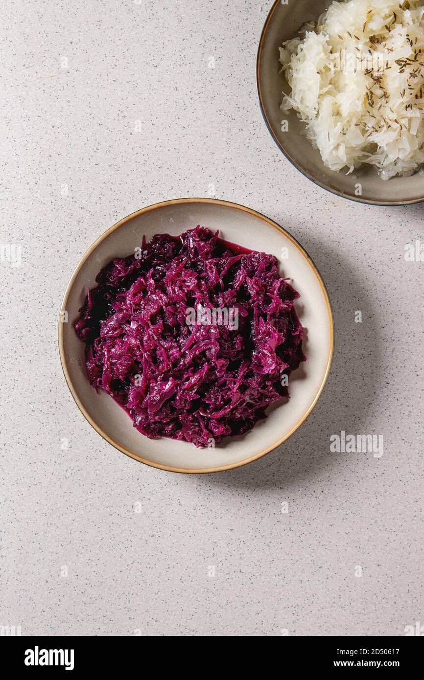 Red and white sauerkraut chopped cabbage pickled in brine with cumin in ...