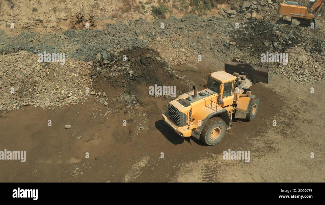 Earthmoving machine for excavation and dumping of soil Stock Photo - Alamy