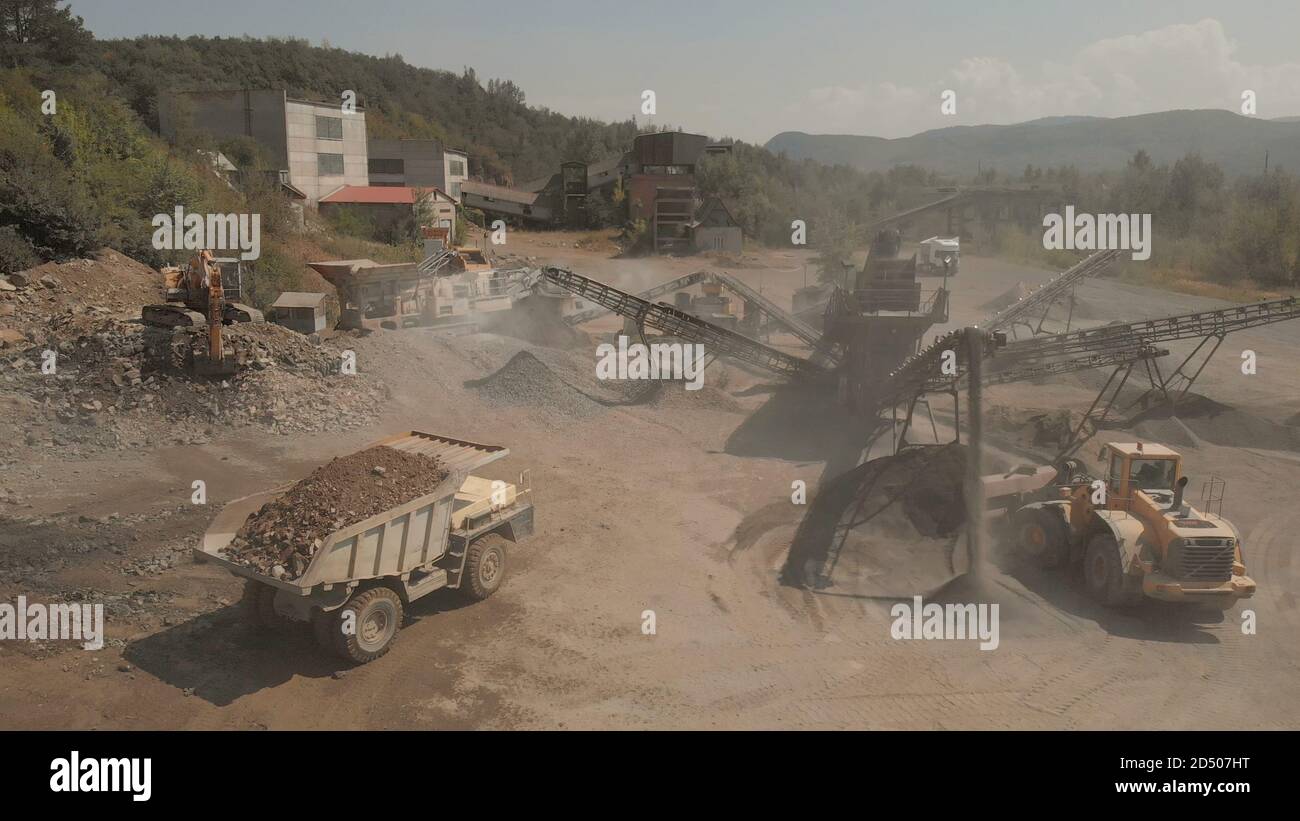 Excavator pours soil tipper truck hi-res stock photography and images ...