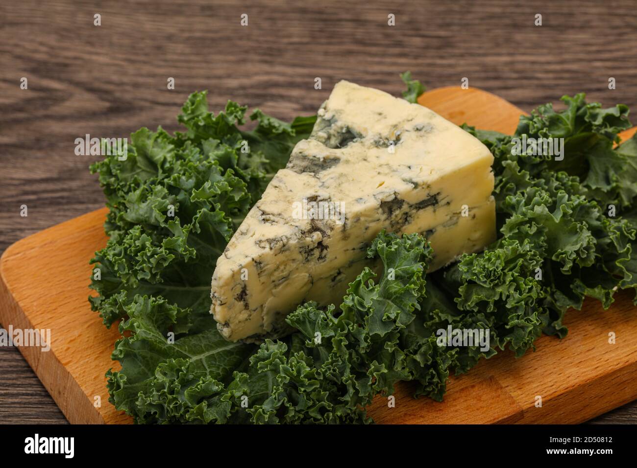 Dairy Blue cheese triangle with mold Stock Photo - Alamy