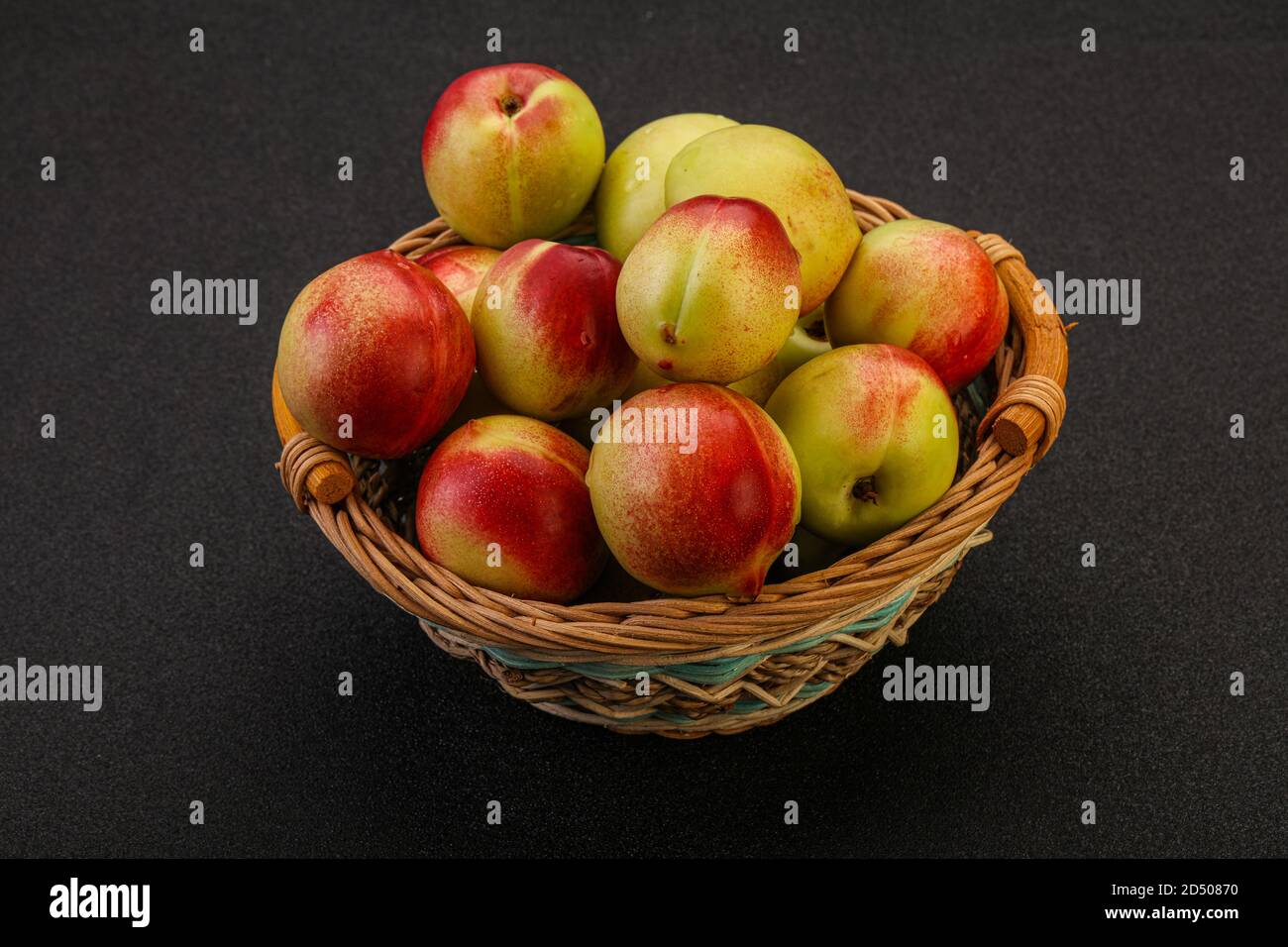 Sweet small green nectarines in the basket Stock Photo - Alamy