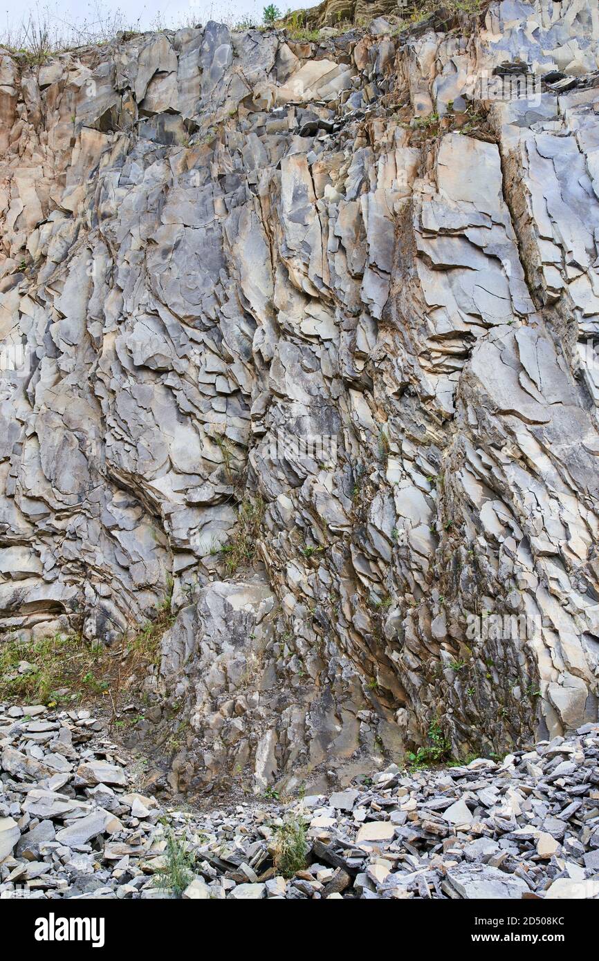 Various rock formation in geological layers in an abandoned quarry ...