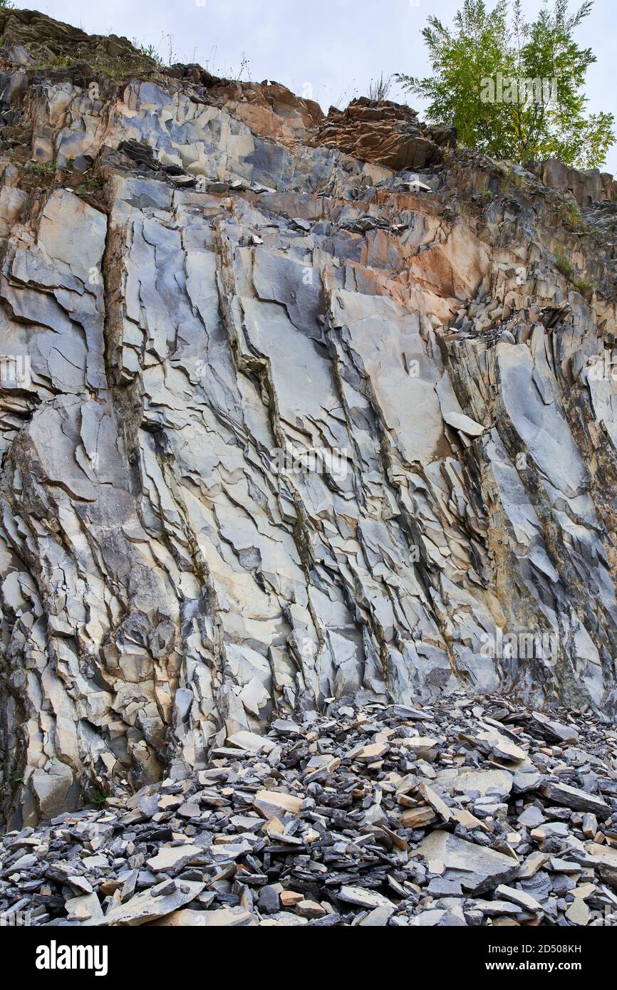 Various rock formation in geological layers in an abandoned quarry ...