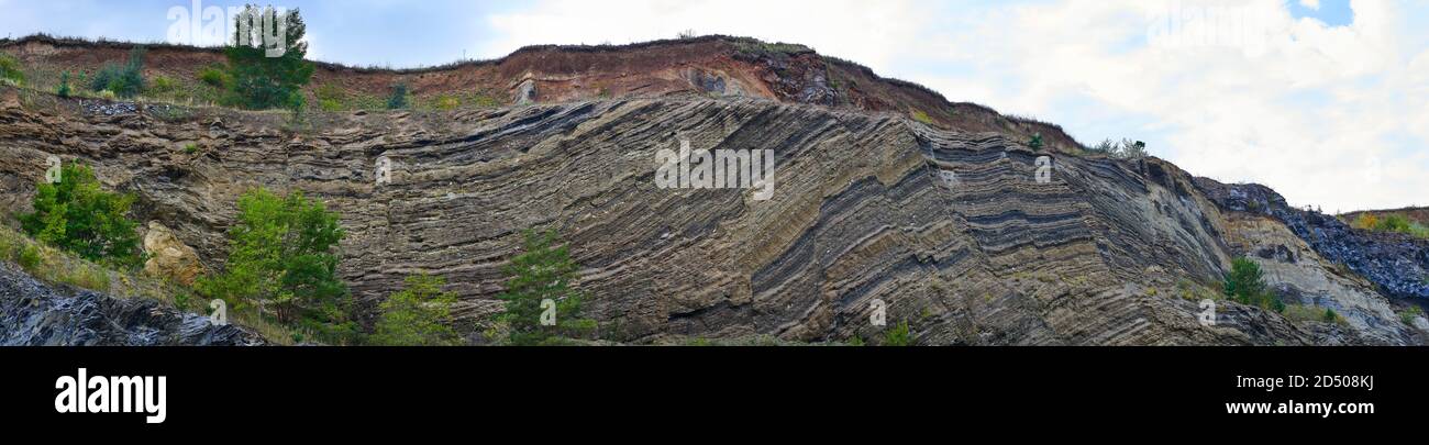 Various rock formation in geological layers in an abandoned quarry ...