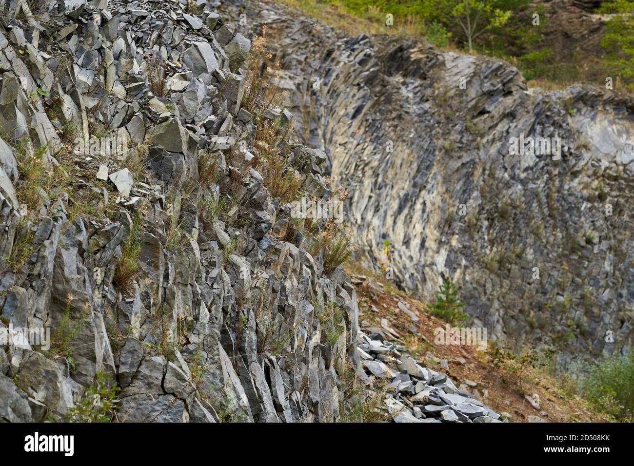 Various rock formation in geological layers in an abandoned quarry ...