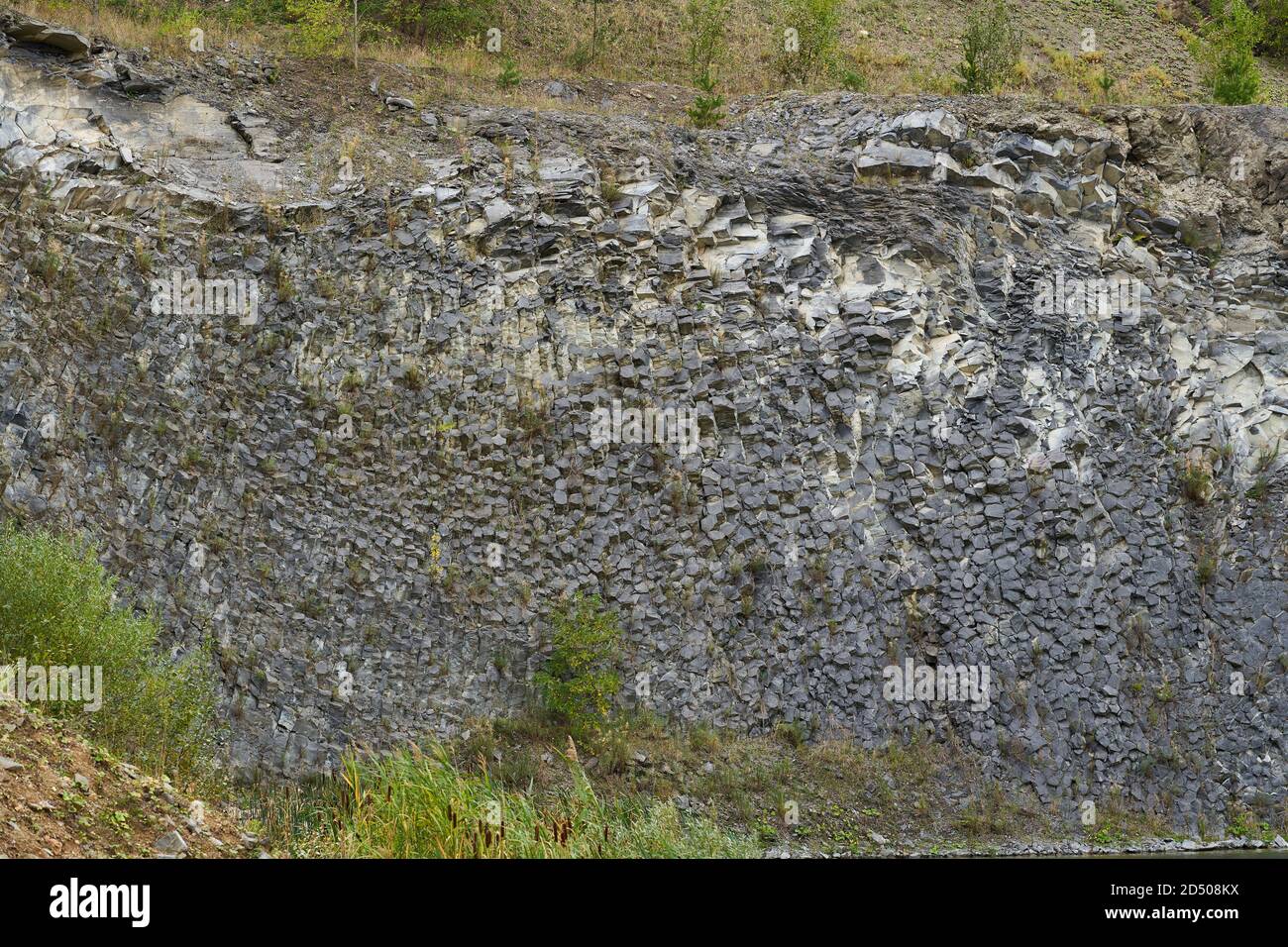 Various rock formation in geological layers in an abandoned quarry ...