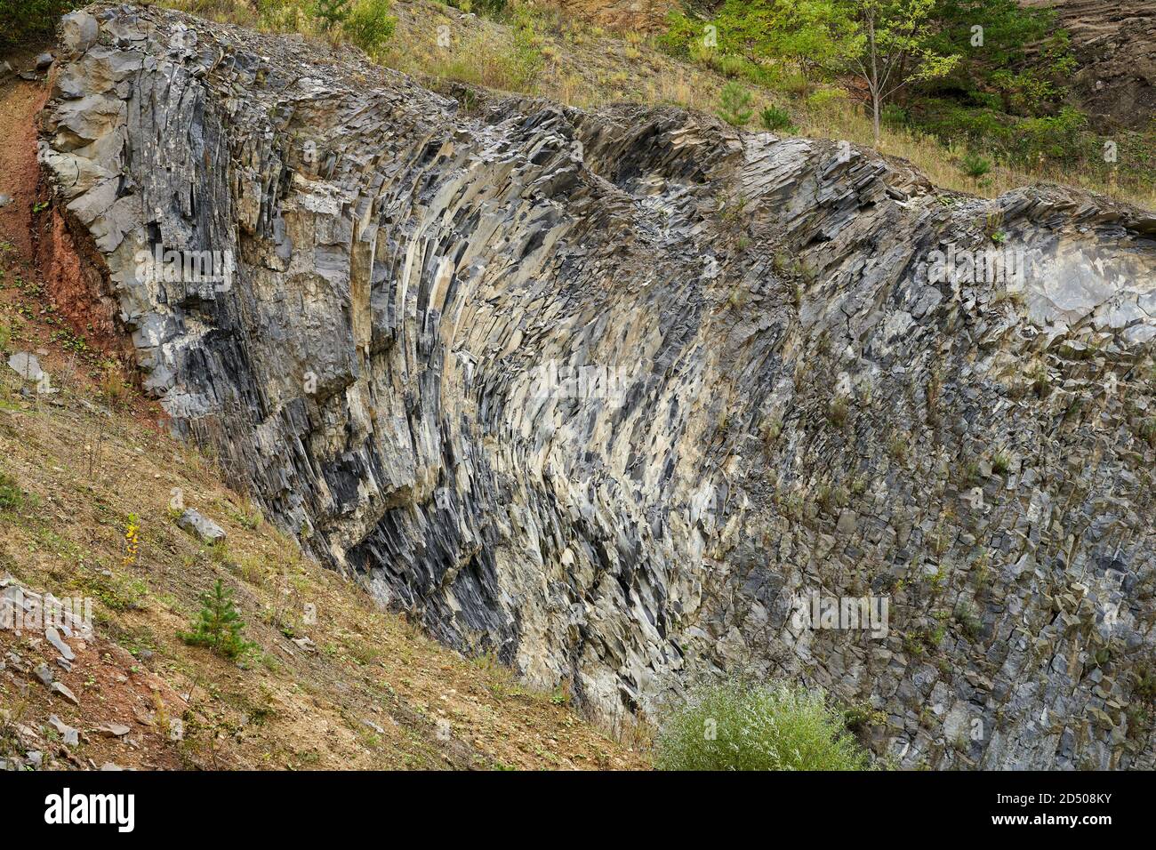 Various rock formation in geological layers in an abandoned quarry ...