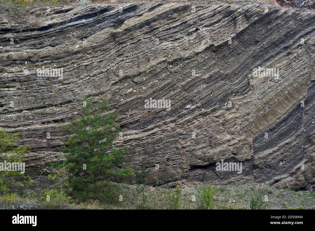 Various rock formation in geological layers in an abandoned quarry ...