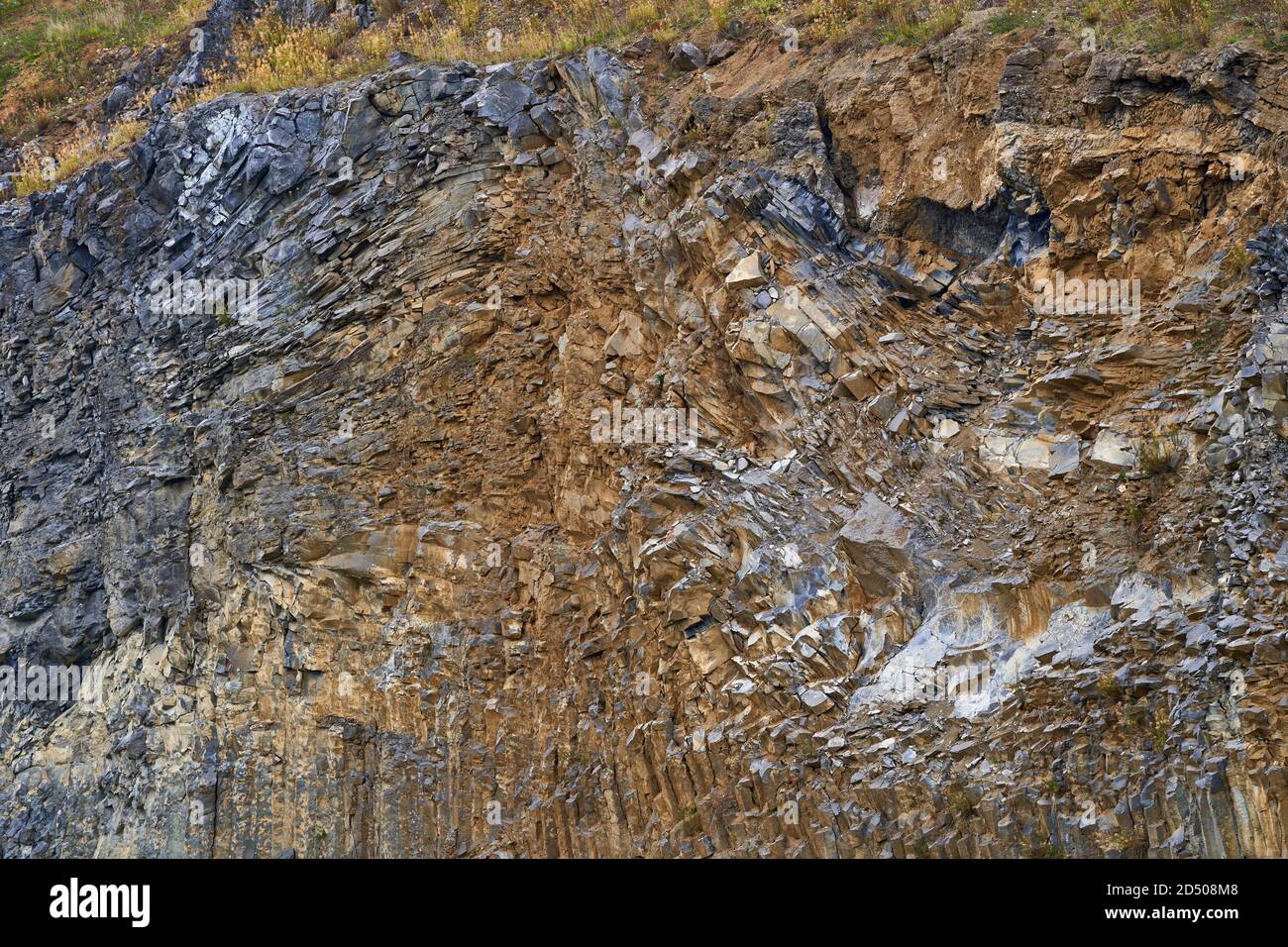 Various rock formation in geological layers in an abandoned quarry ...