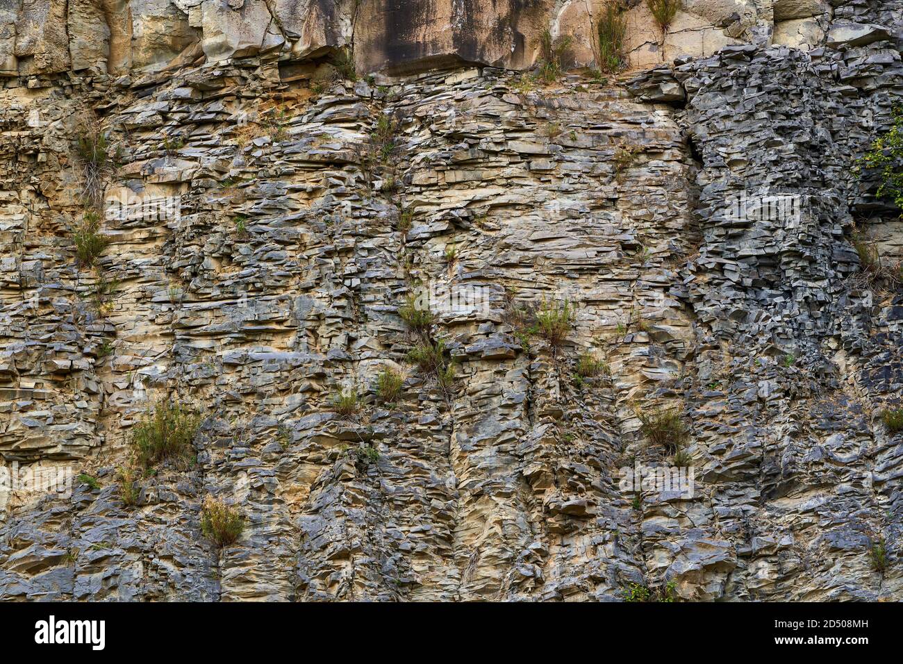 Various rock formation in geological layers in an abandoned quarry ...
