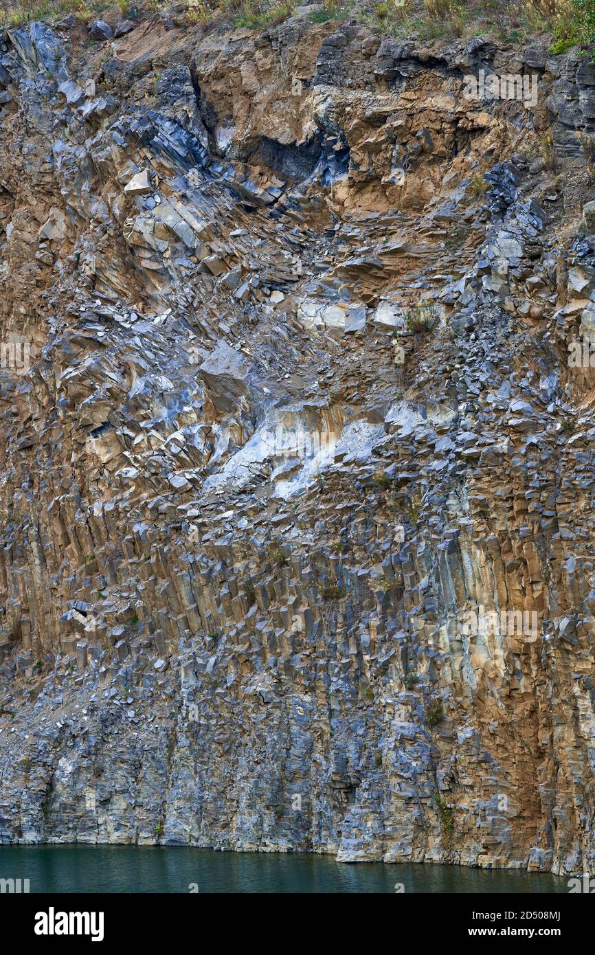 Various rock formation in geological layers in an abandoned quarry ...