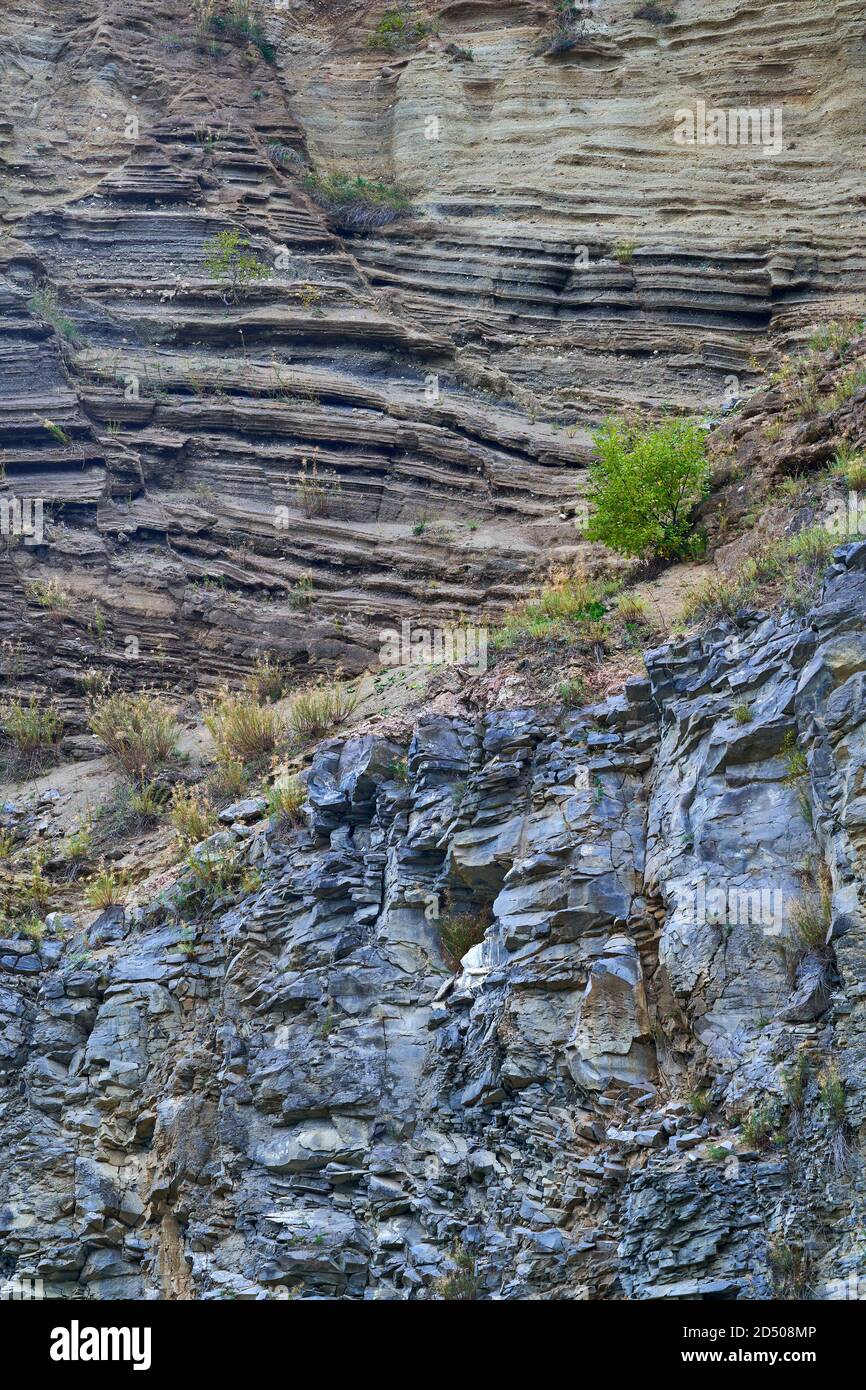 Various rock formation in geological layers in an abandoned quarry ...