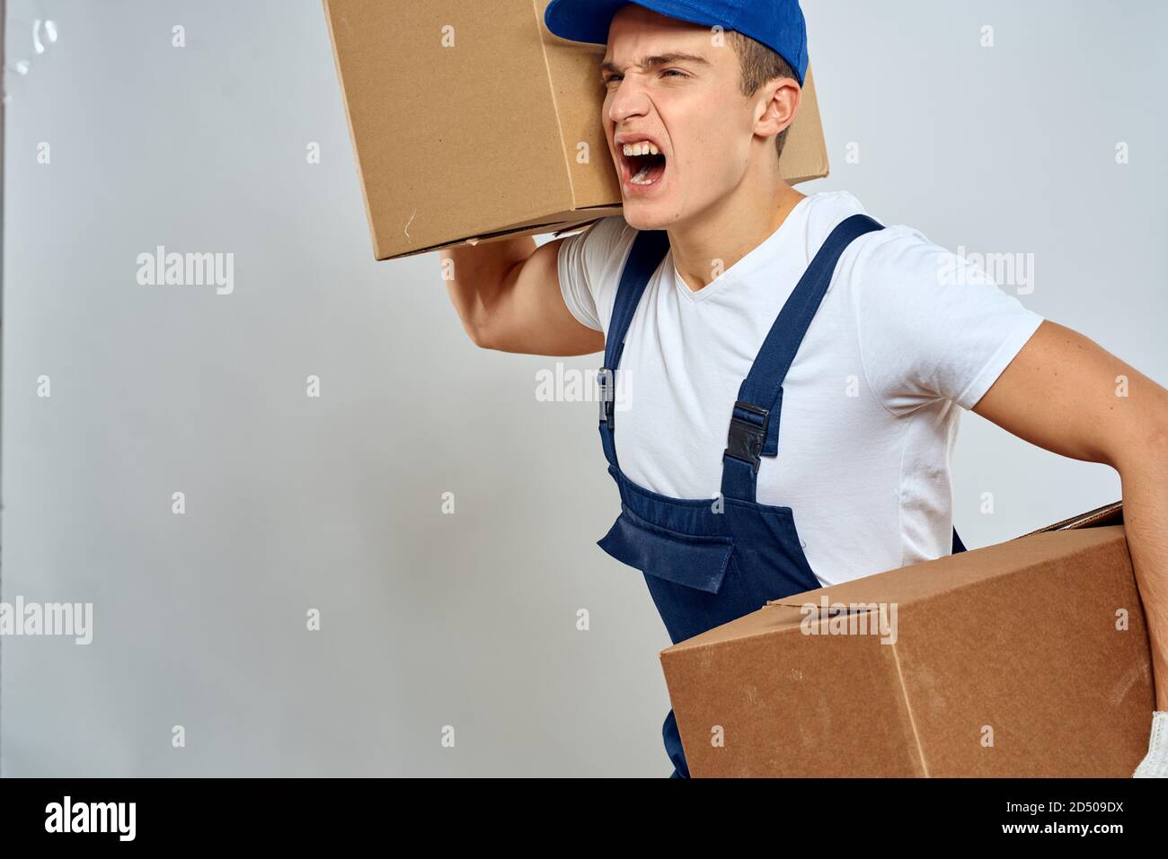 Man worker with box in hands delivery loading service packing service ...