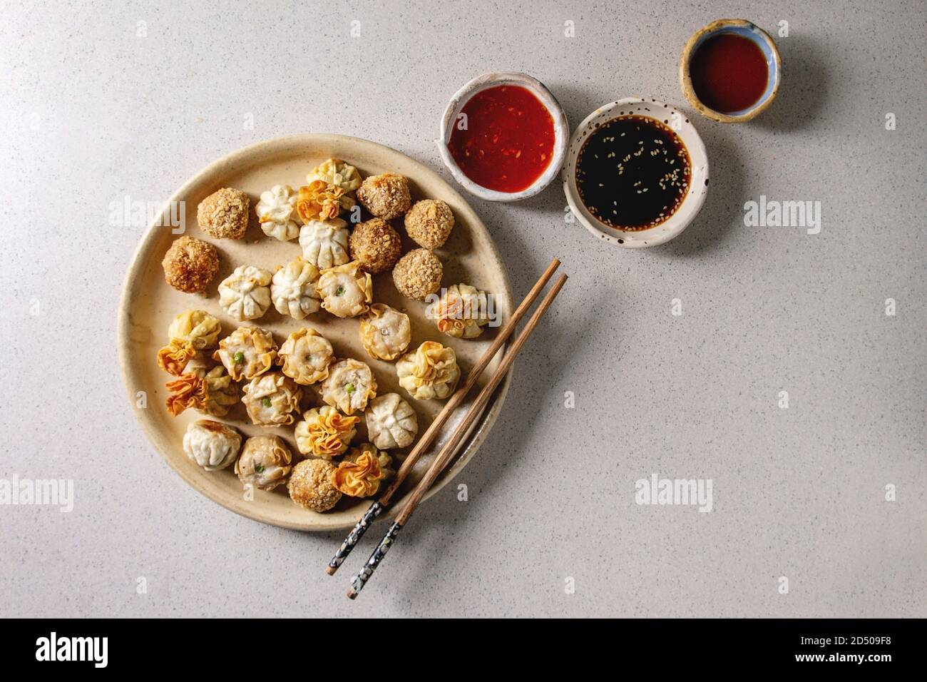 Dim sum Gyozas asian fried dumplings party set with variety of sauces ...