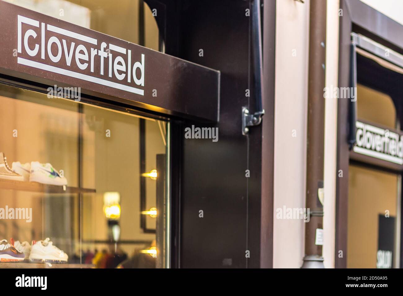 RAVENNA, ITALY - FEBRUARY 19, 2019: sunlight is enlightening shop sign ...
