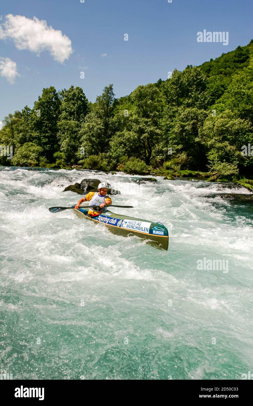An unidetified kayakist navigates his kayak through the whitewater of ...