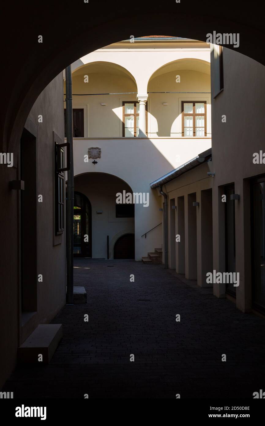Baroque building of the catholic convent (18th century), arched gateway ...