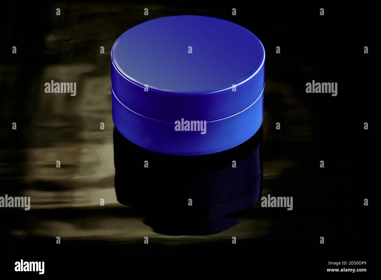 Blue plastic jar in water on a dark background. Layout for advertising ...