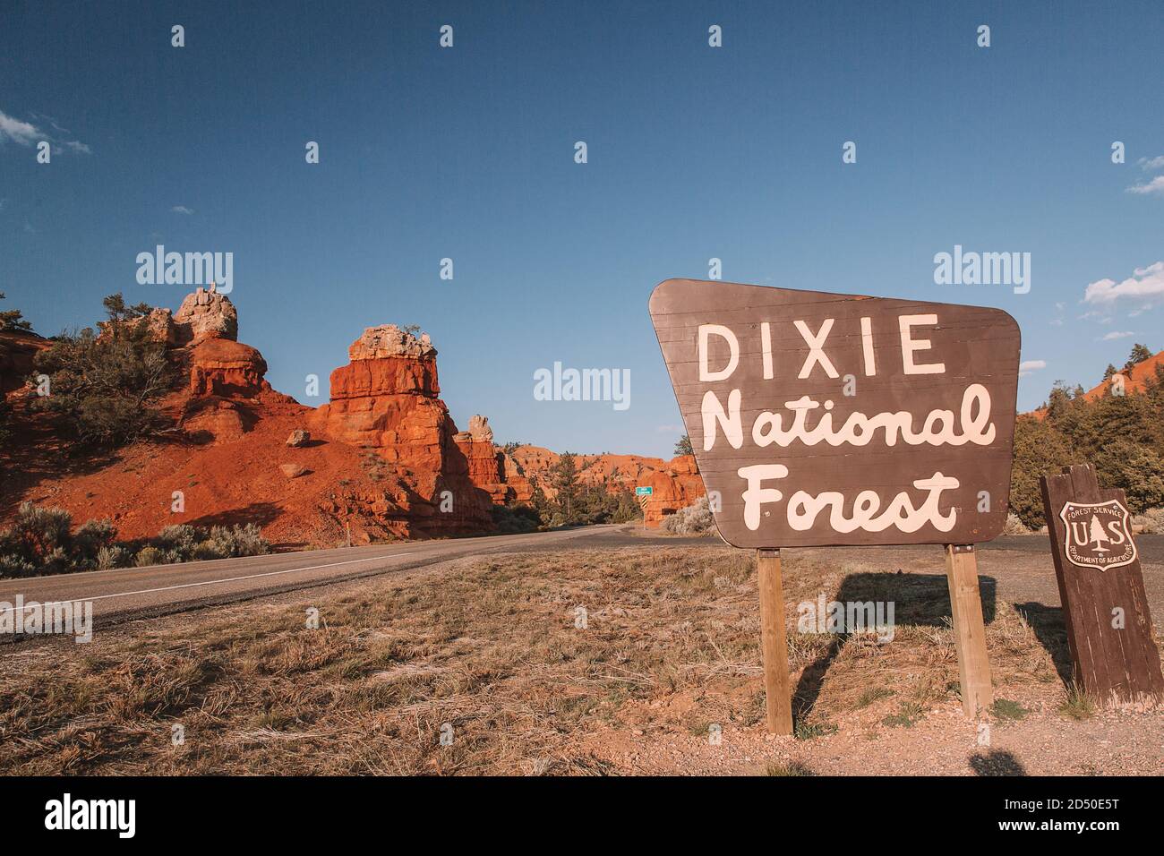 View of a signboard to the famous Dixie National Forest on a clear blue ...