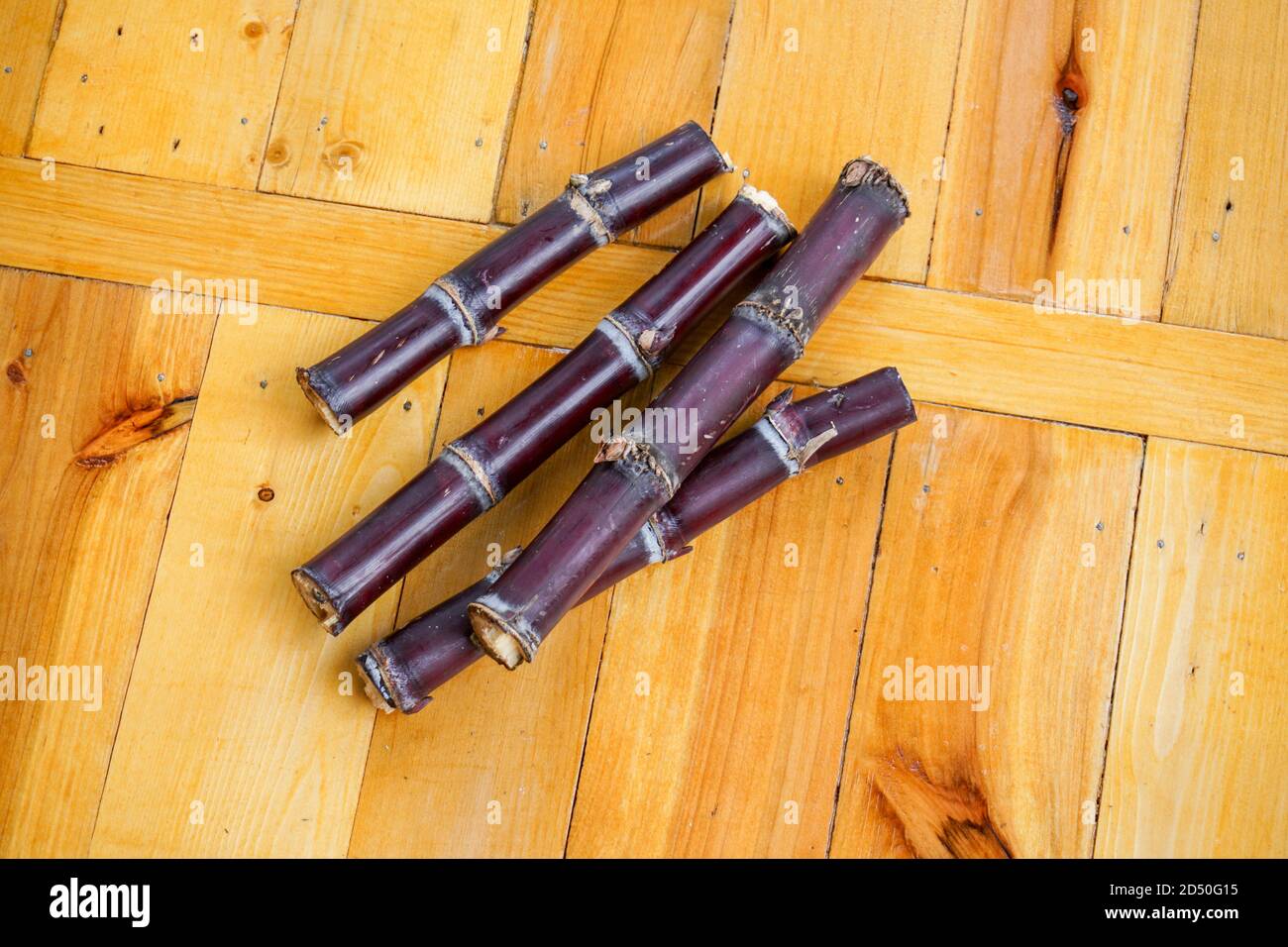 Sugar cane on wooden table background Stock Photo - Alamy