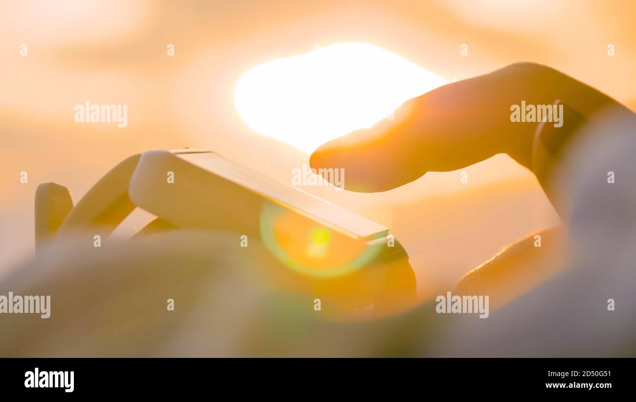 Close up: woman hand using wearable white smartwatch device against ...