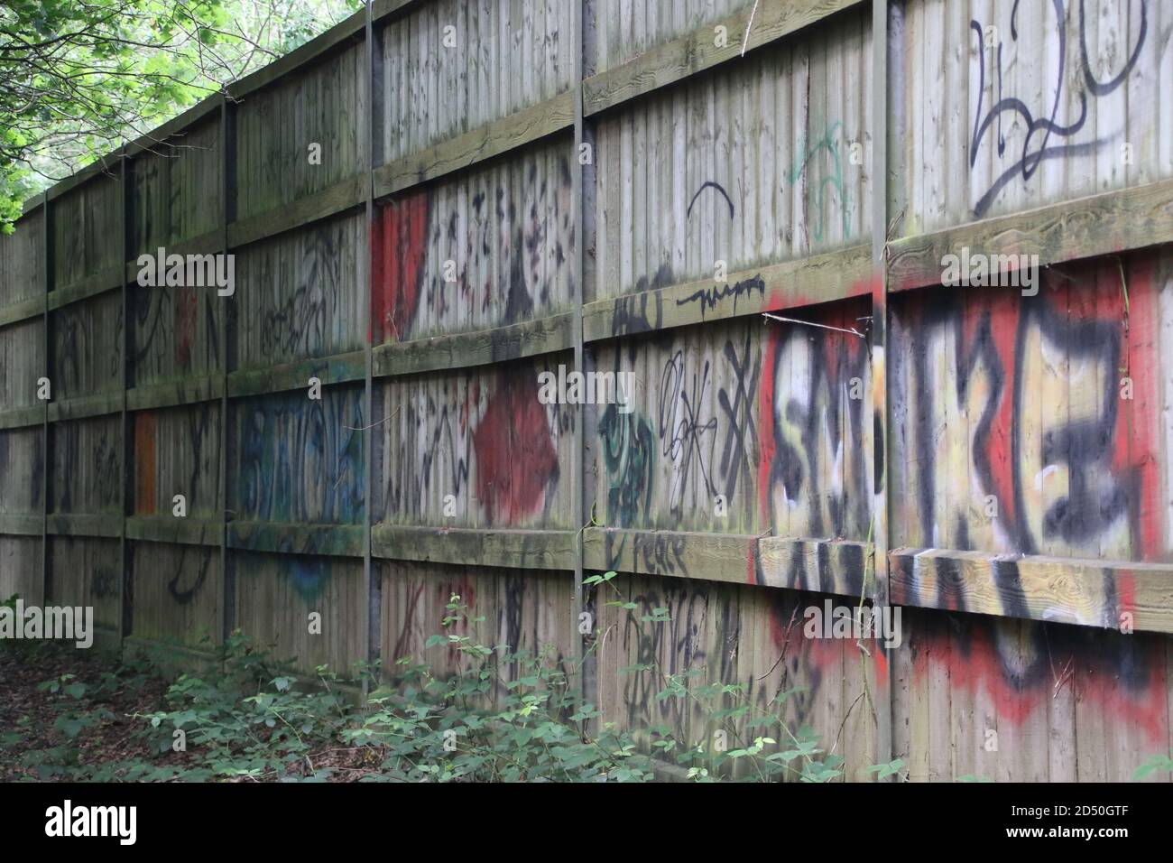 graffiti spray painted onto a wooden fence Stock Photo - Alamy