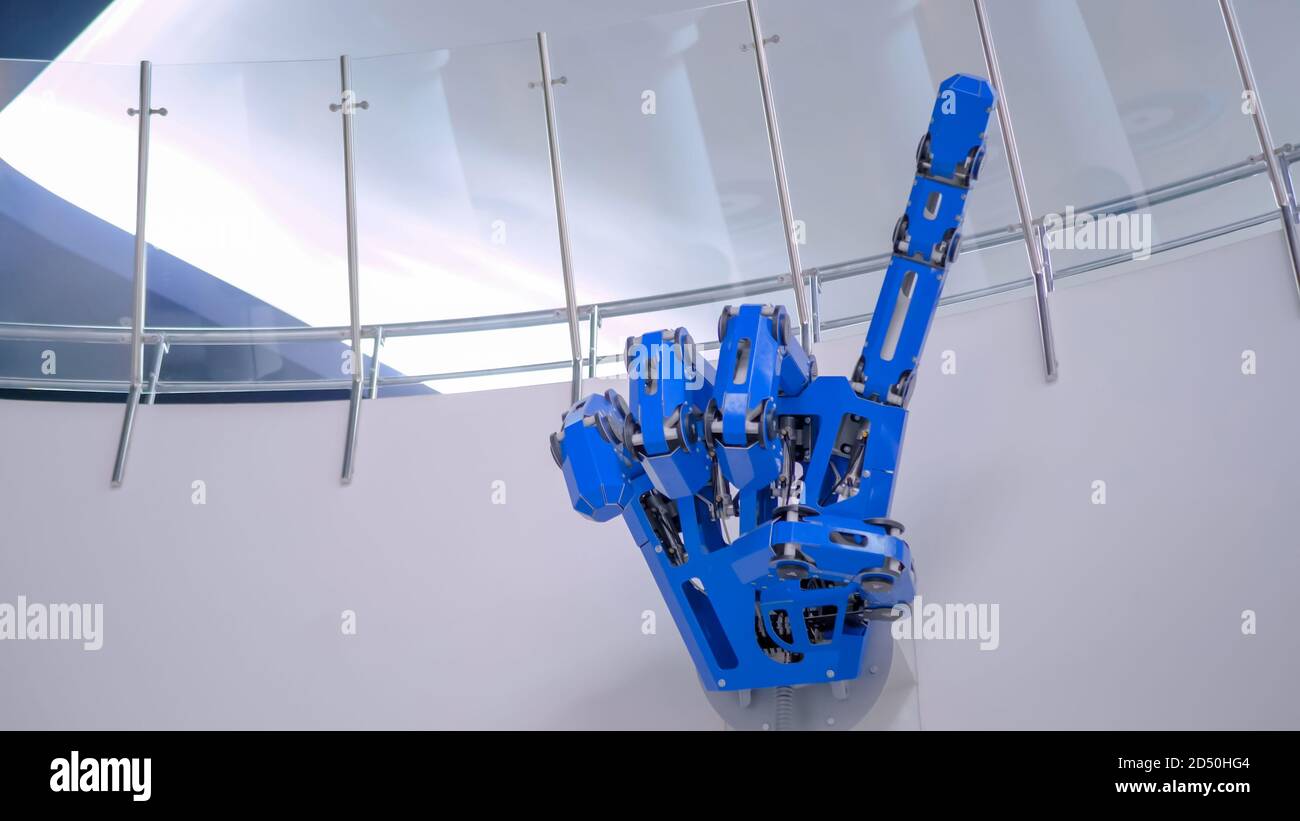 Futuristic big blue mechanical robotic hand with remote control moving ...