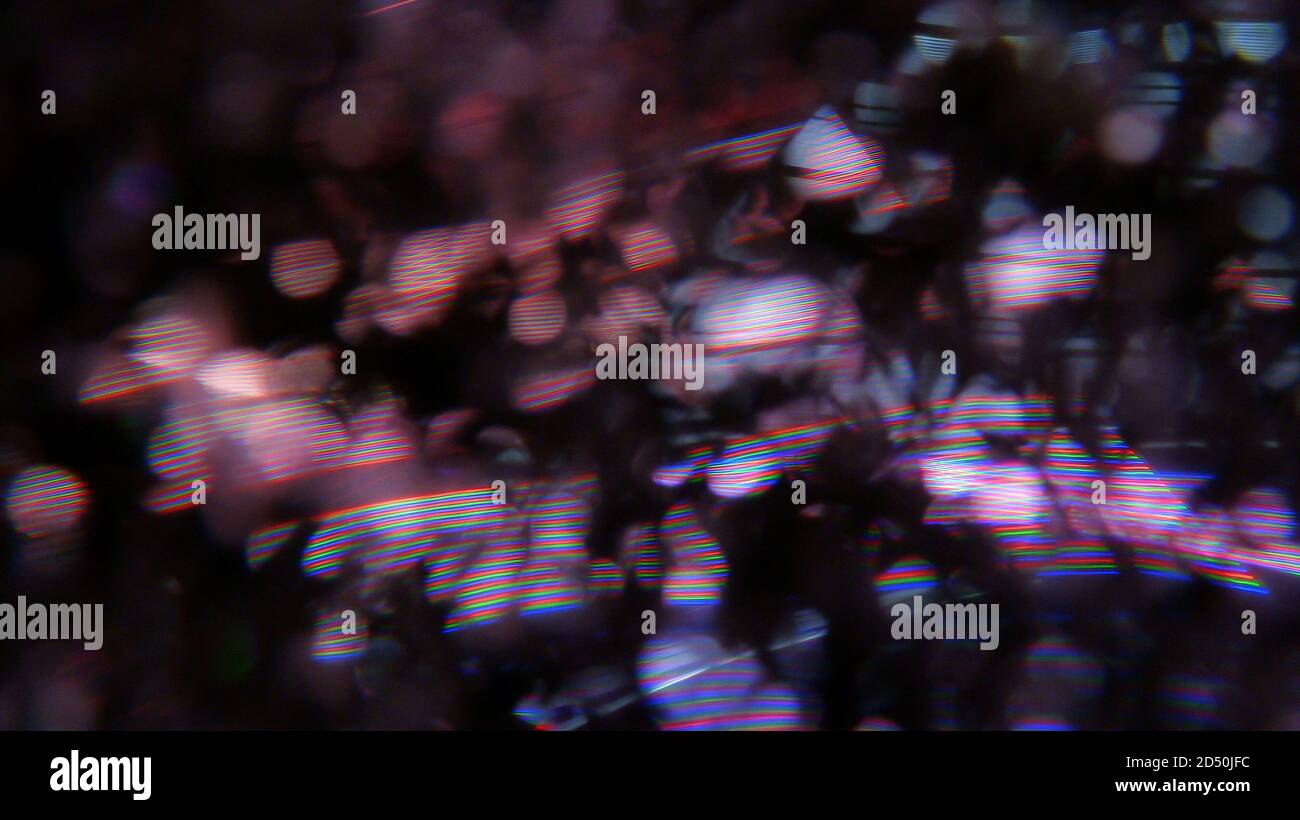 Vibrant pink and purple shaded motion lines seen through dark patterns ...