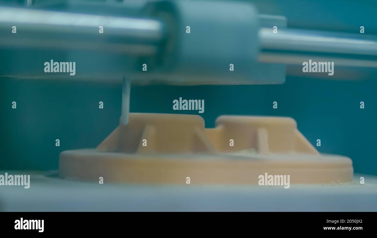 Automated milling machine cutting wooden workpiece from wood pulp ...