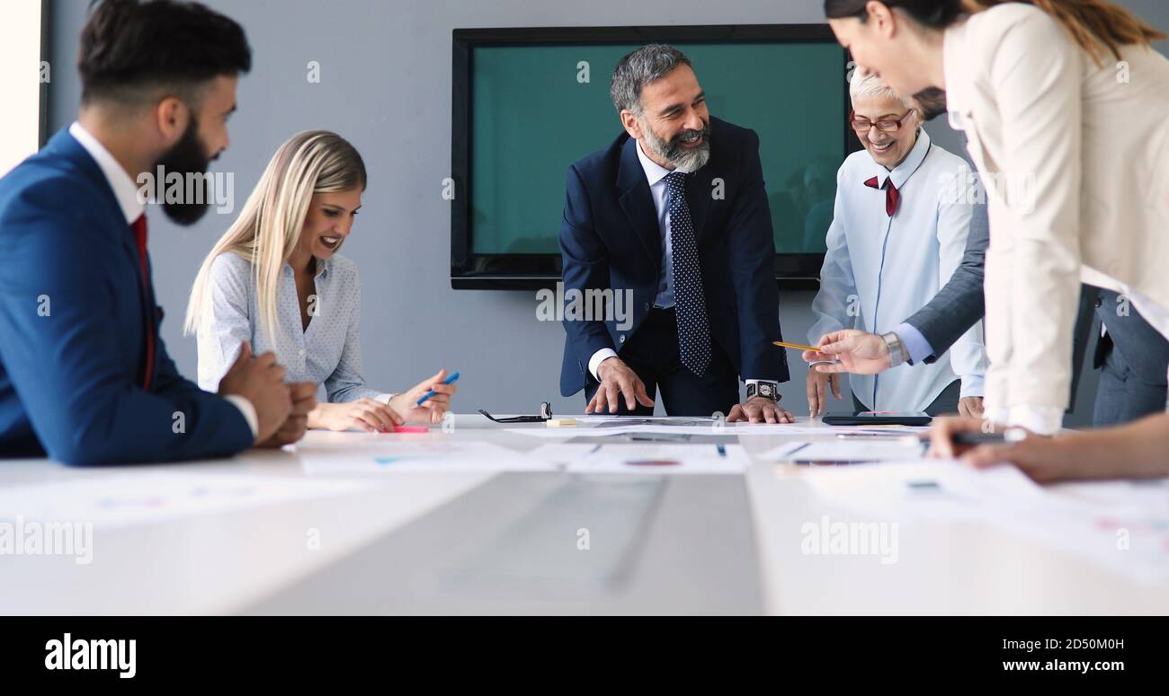 Group of happy business people working in a meeting at office Stock ...