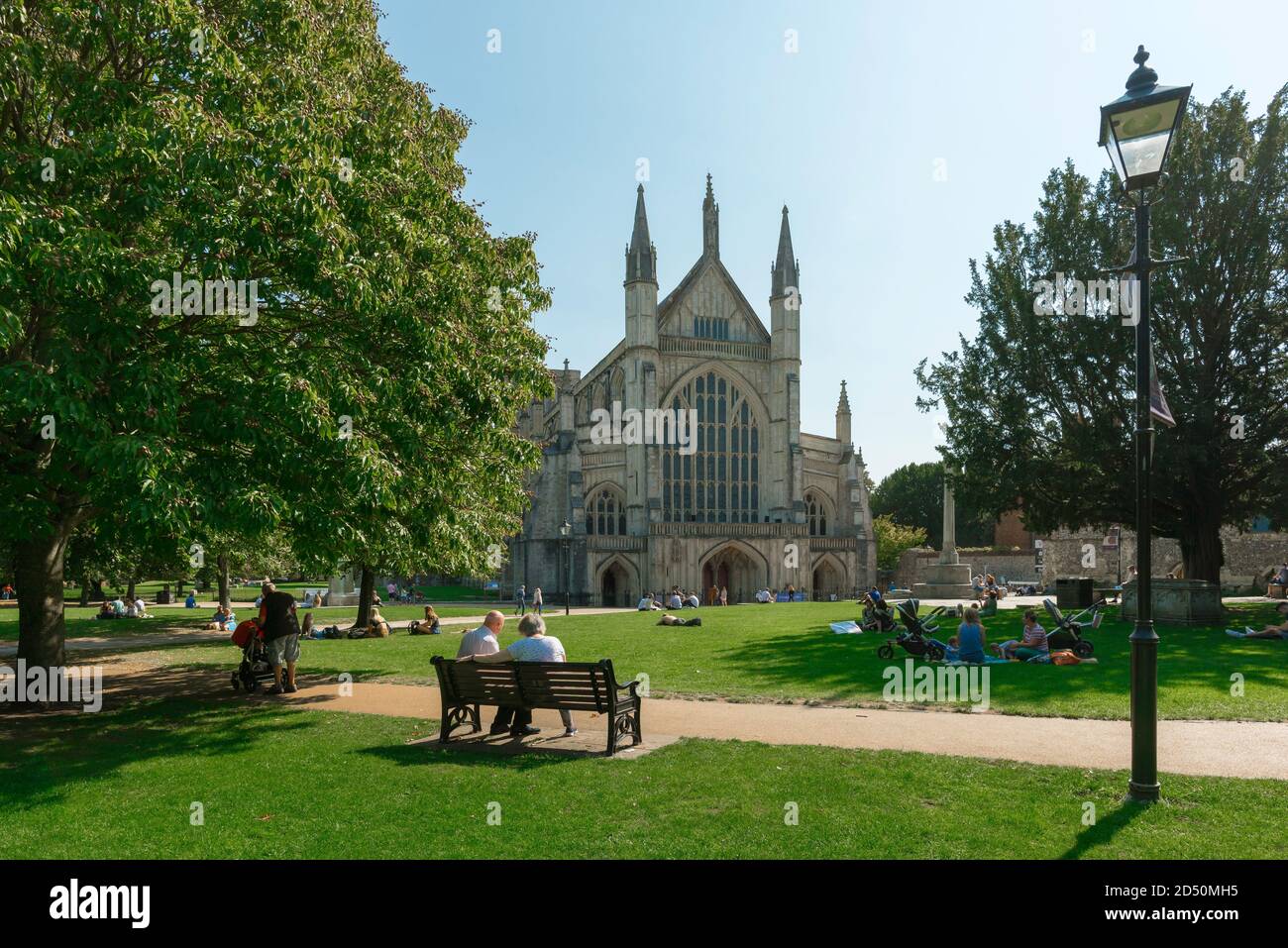 Winchester Cathedral, view in summer of people relaxing in the ...