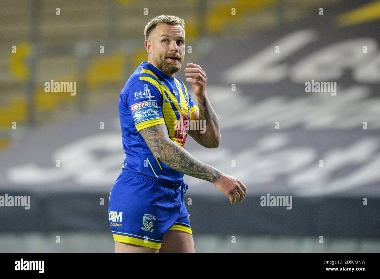 Blake Austin of Warrington Wolves launches attack Stock Photo - Alamy