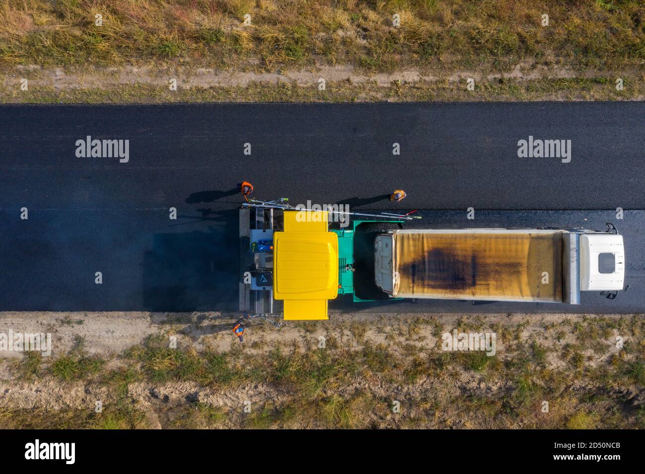 Asphalt paving paver machine new road construction aerial view Stock ...