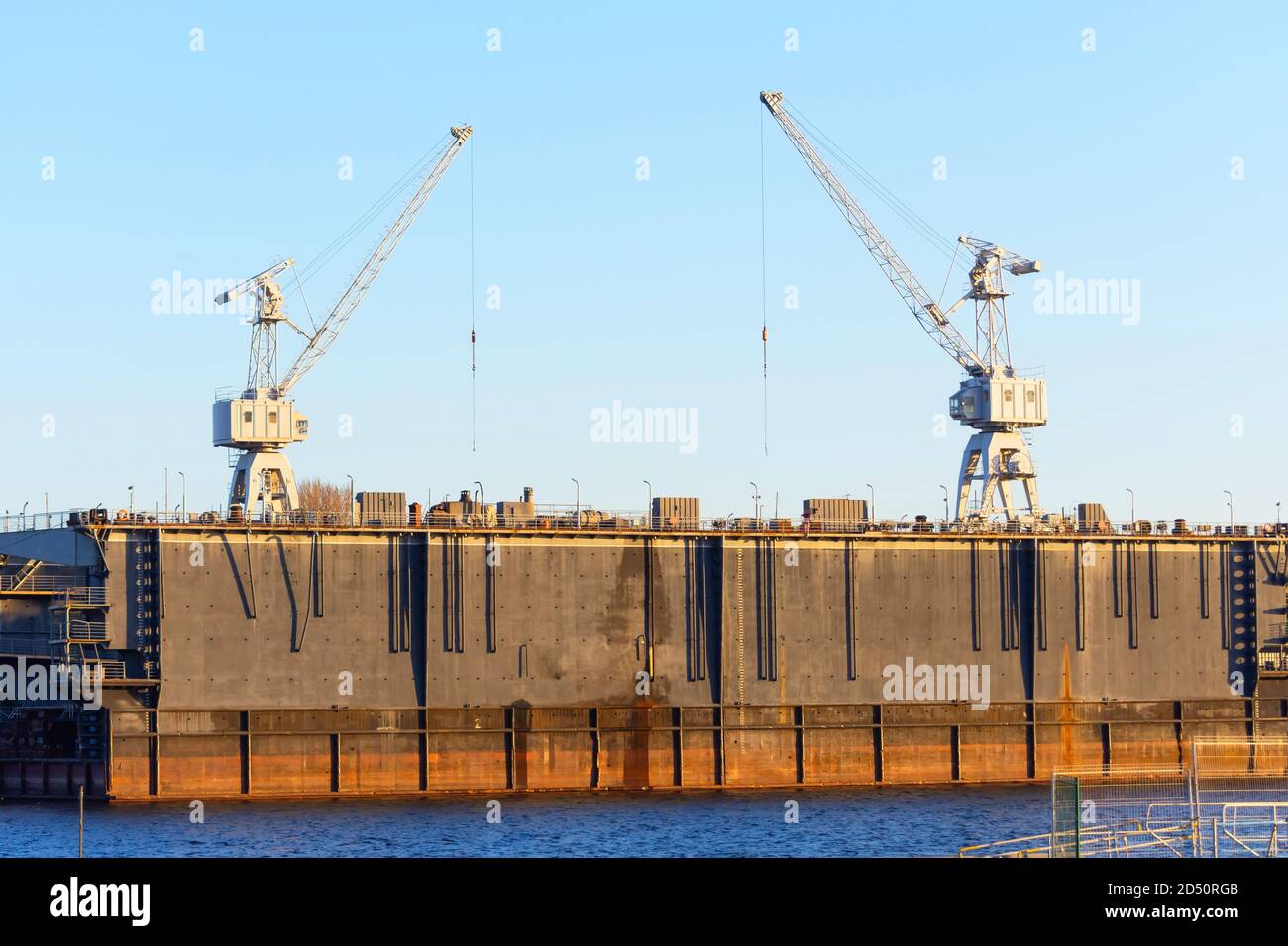 Dry docks for ship repair with cranes, side view Stock Photo - Alamy