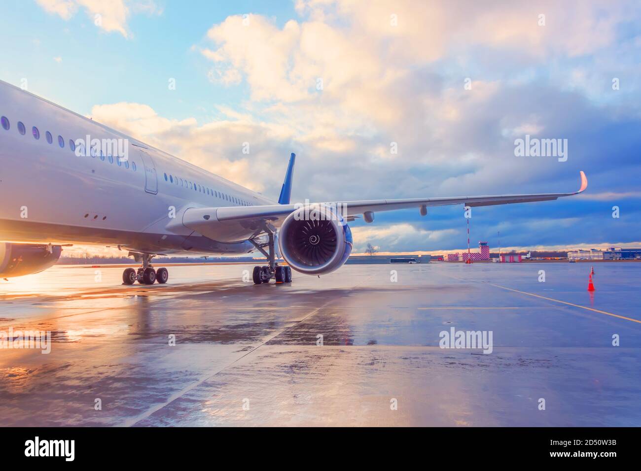 Evening view of a passenger plane wing with engine Stock Photo - Alamy