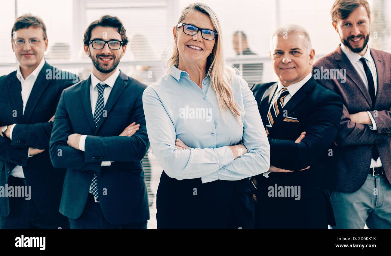 senior business woman standing in front of the business team Stock ...