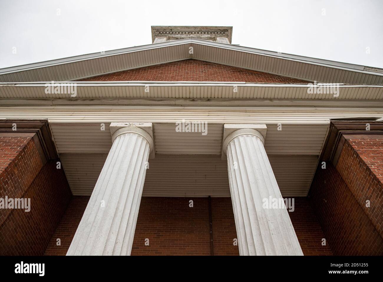 The front facade of the Reformed Church features a portico with twin ...