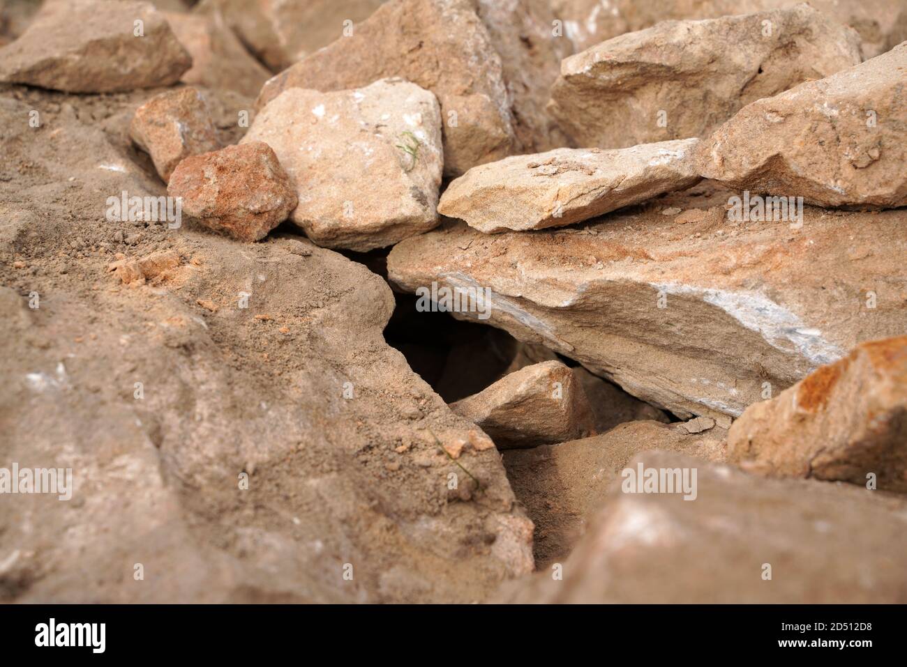 Bricks in a heap to wall Stock Photo - Alamy