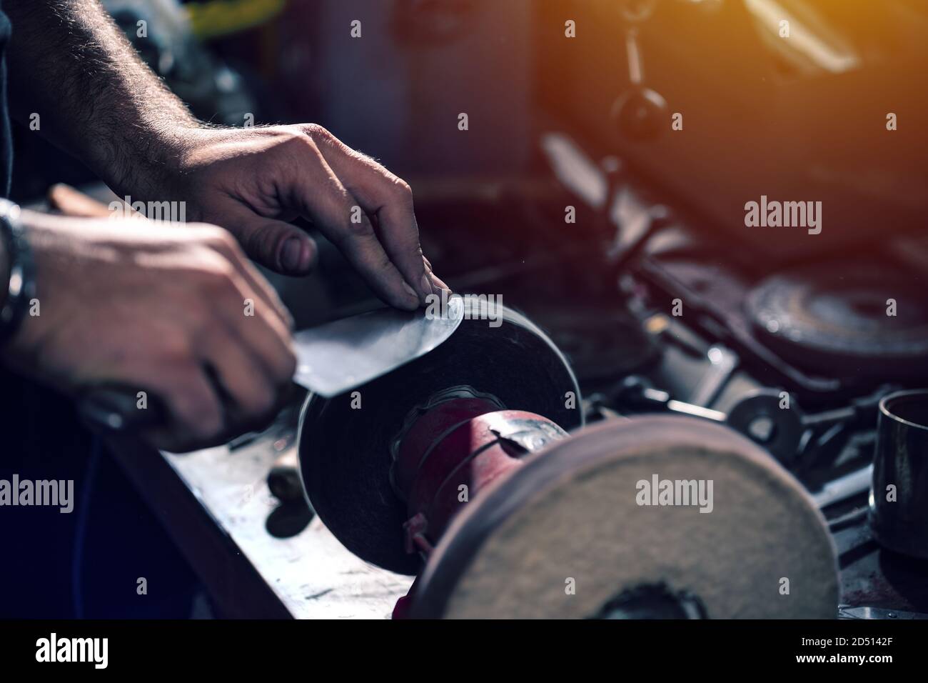 Master man sharpens Stock Photo - Alamy