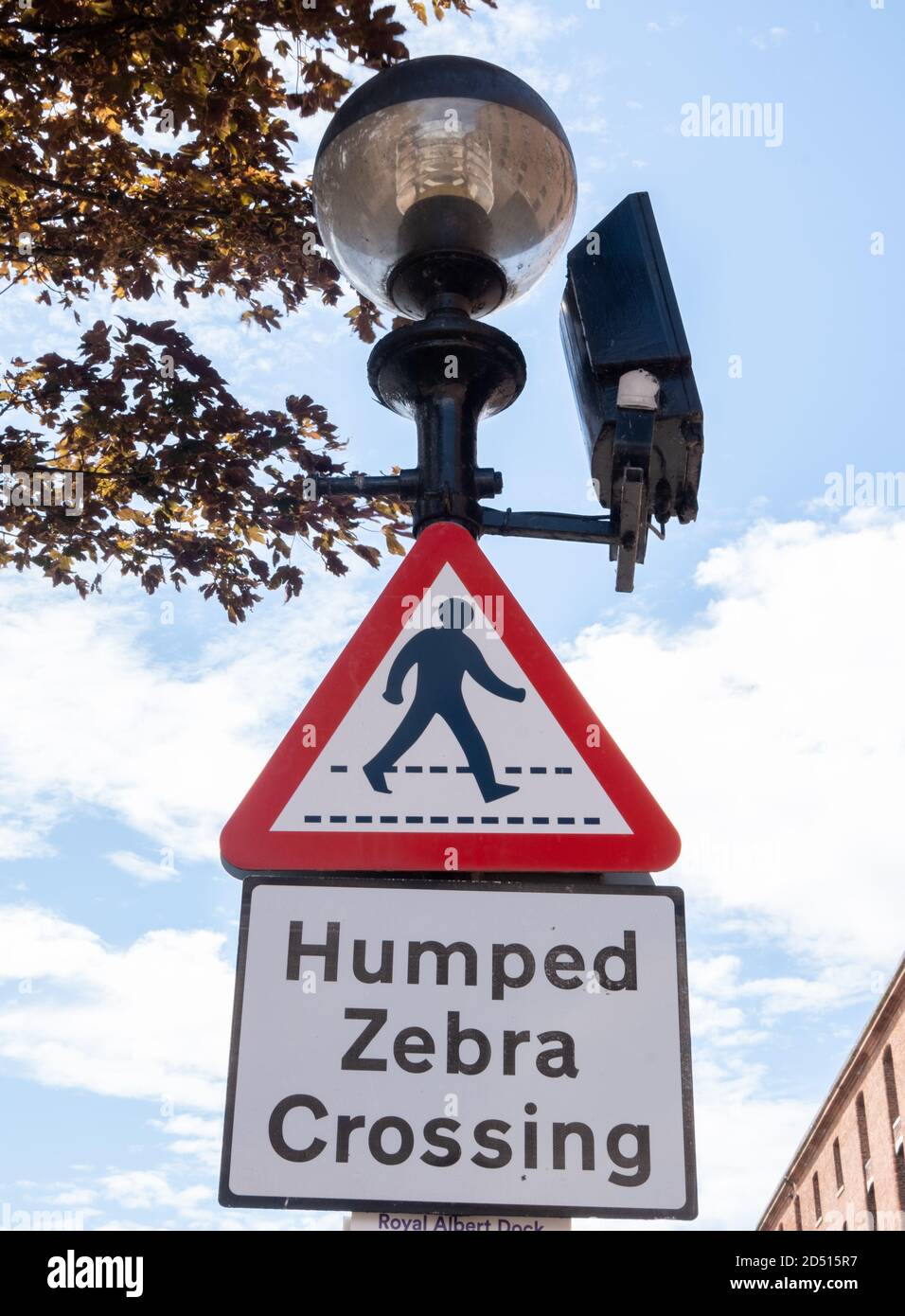 Red triangular sign warning of humped zebra crossing in Liverpool July ...